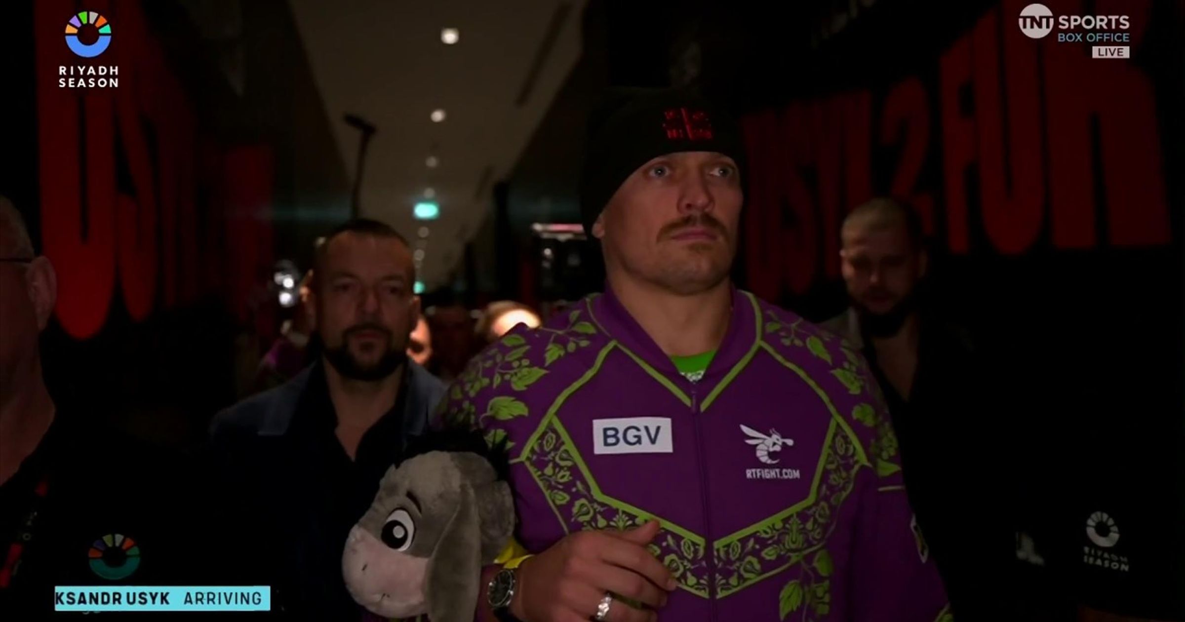 Oleksandr Usyk enters the arena carrying Eeyore teddy ahead of Tyson ...