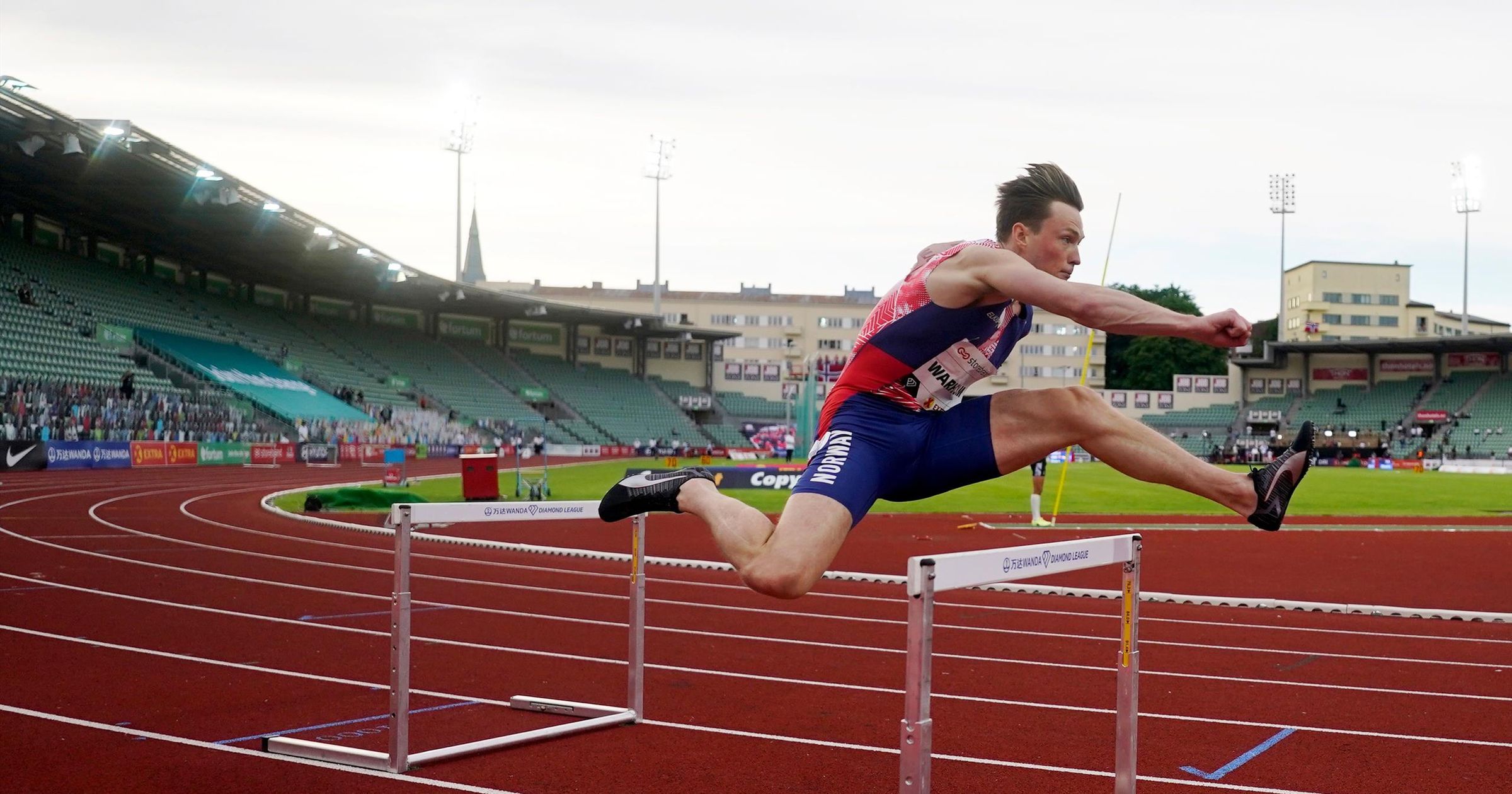 Karston Warholm sets 300m hurdles world record in front of cardboard ...