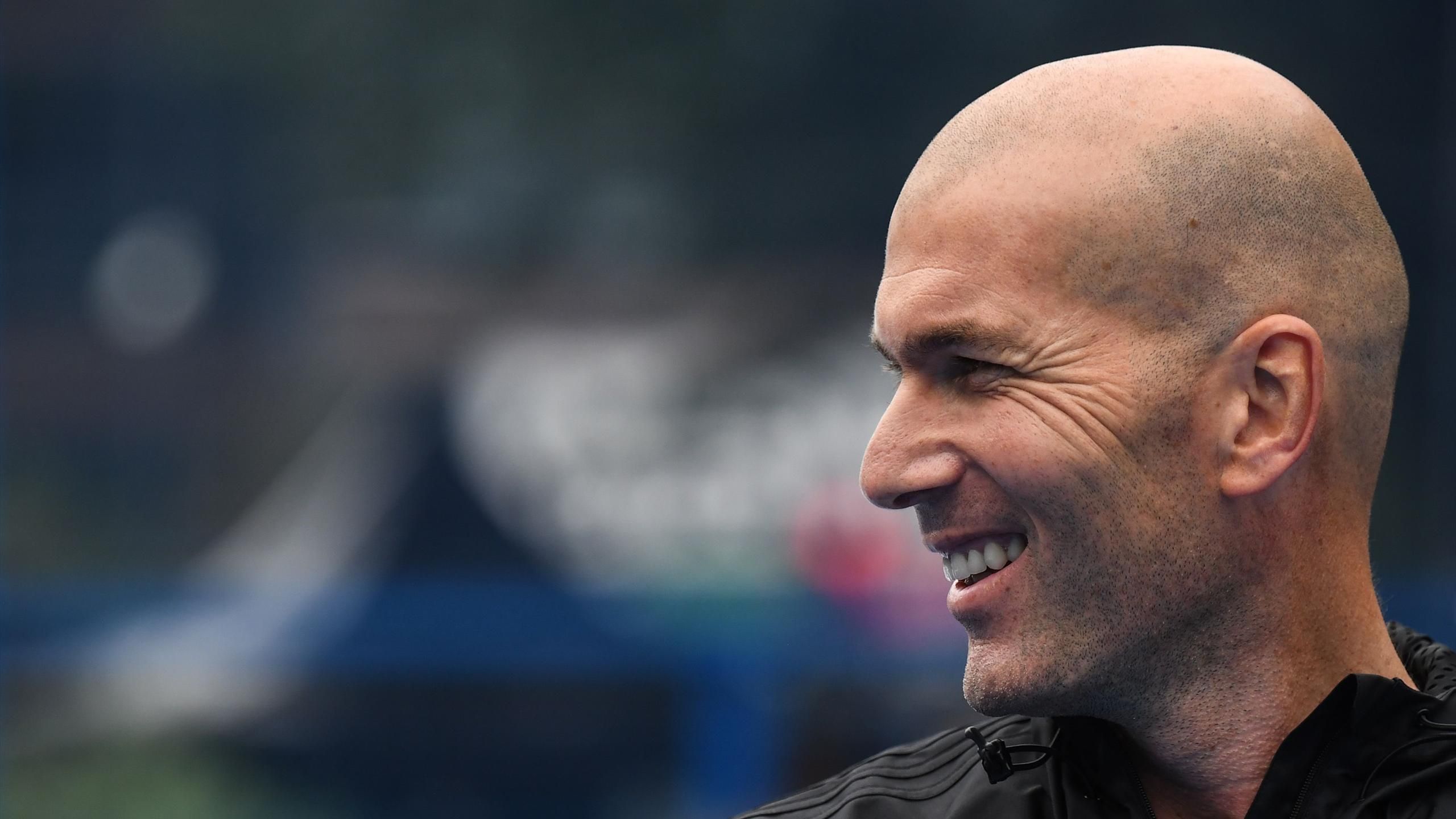 PHOTOS: Manchester United fans pose with Zinedine Zidane cut-outs ...