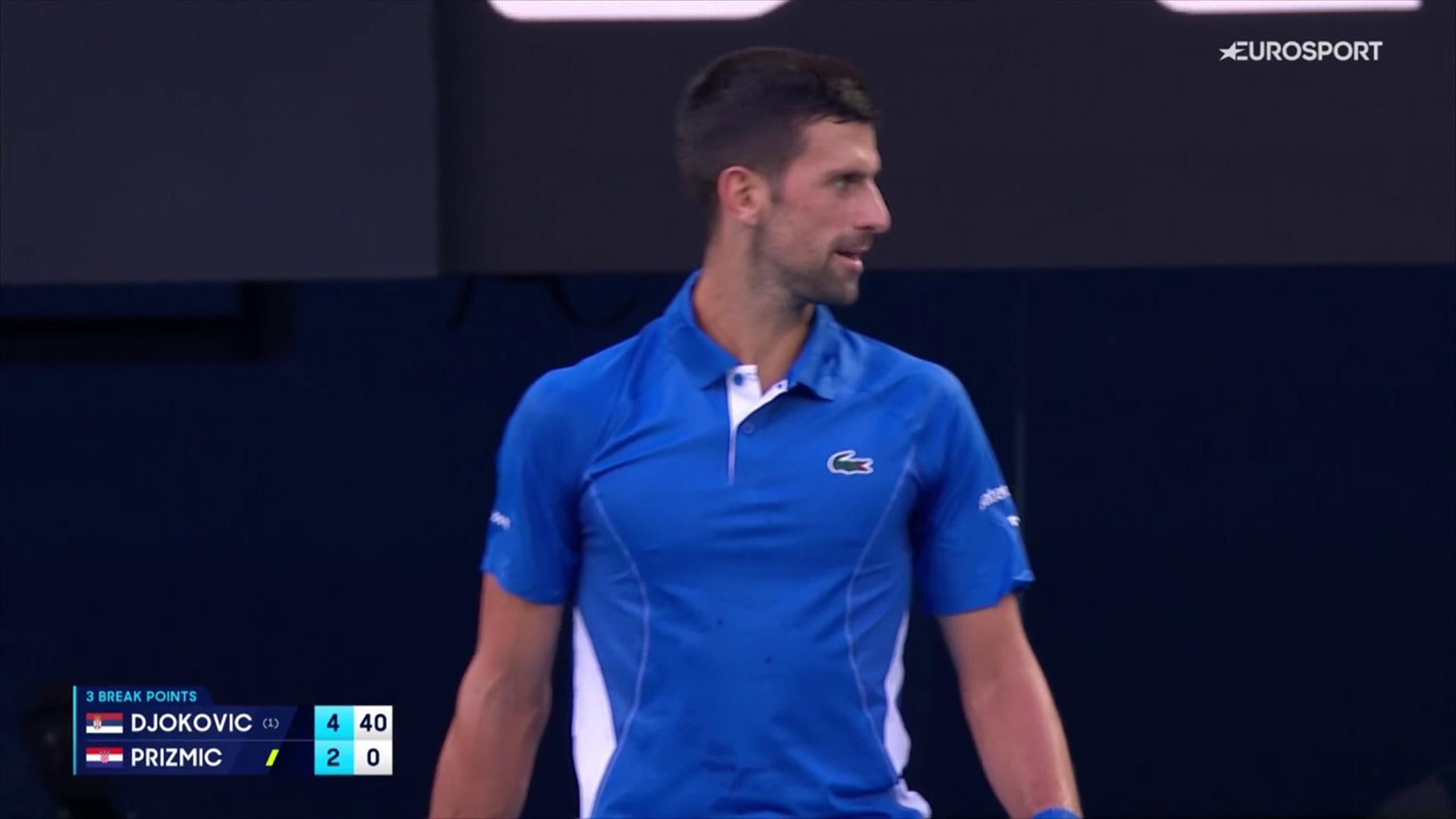 Novak Djokovic reacts to phone ringing in stands during opening match ...