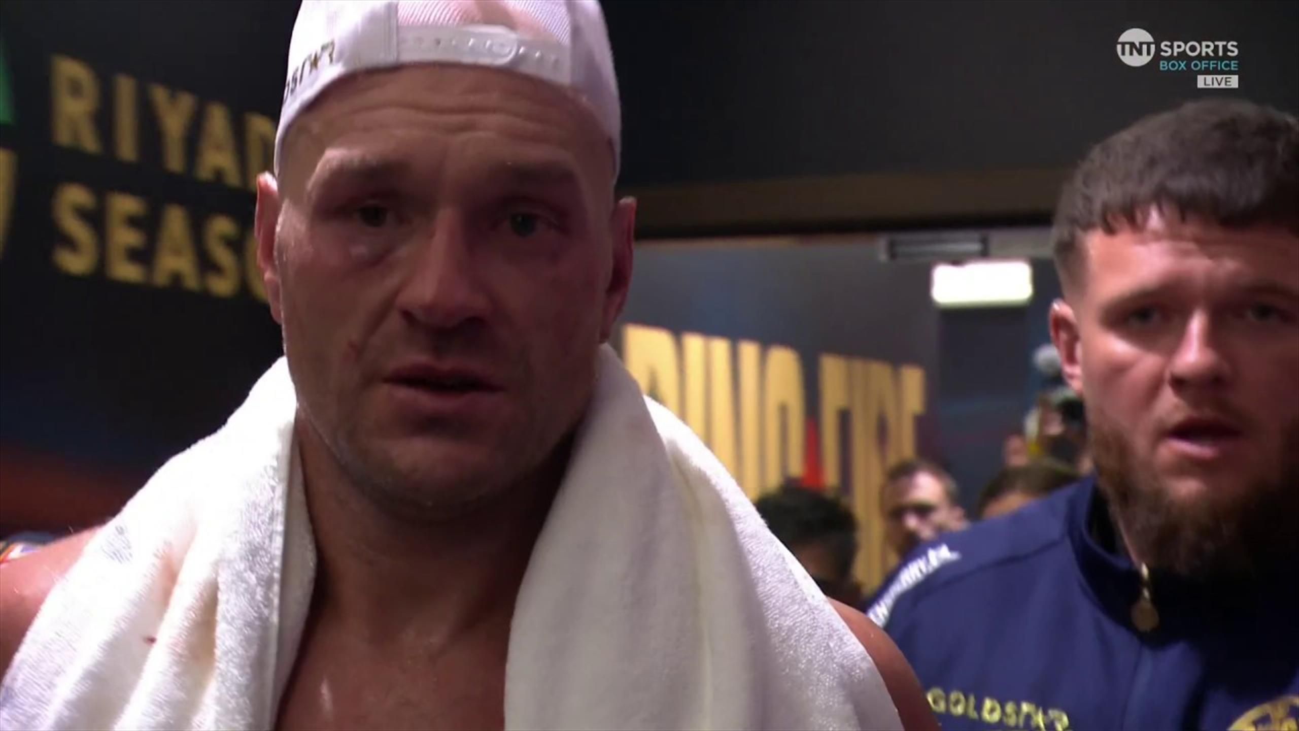 Tyson Fury makes his way back to his dressing room after losing to ...