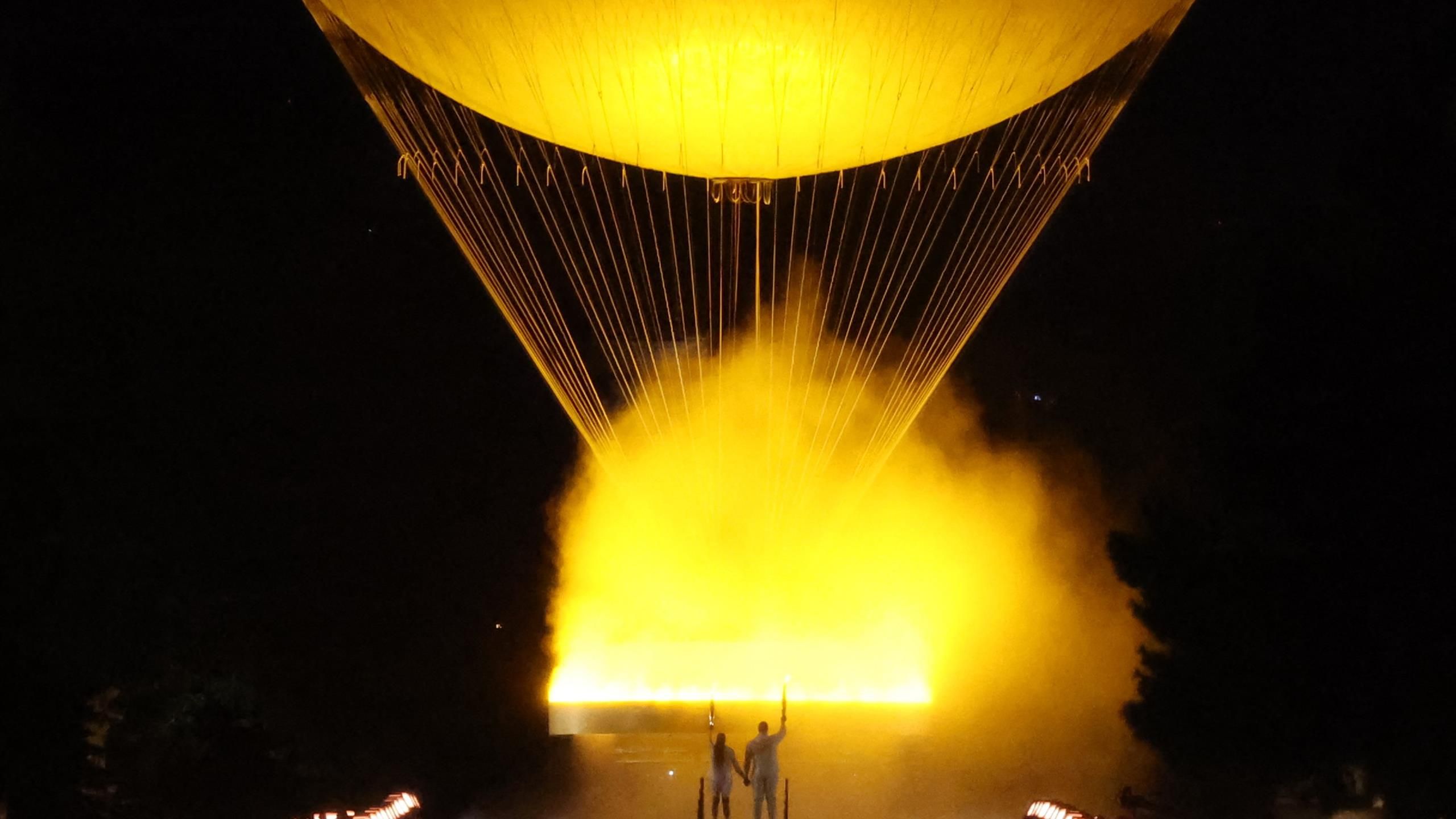 Olympic flame under magnificent balloon is lit as Paris 2024 Games ...