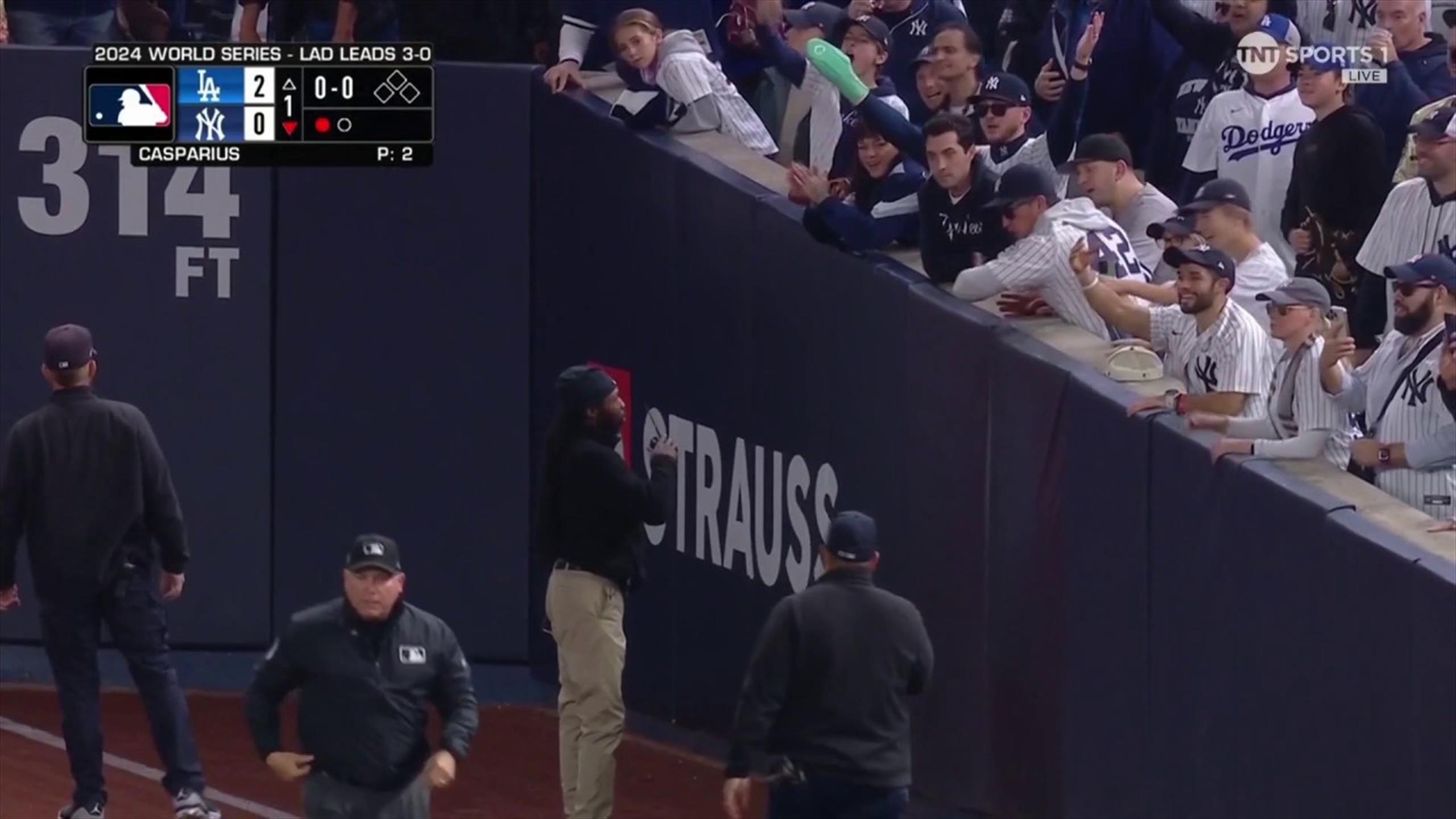 'He's wrestling with the fan!' - Watch INCREDIBLE fan interference ...