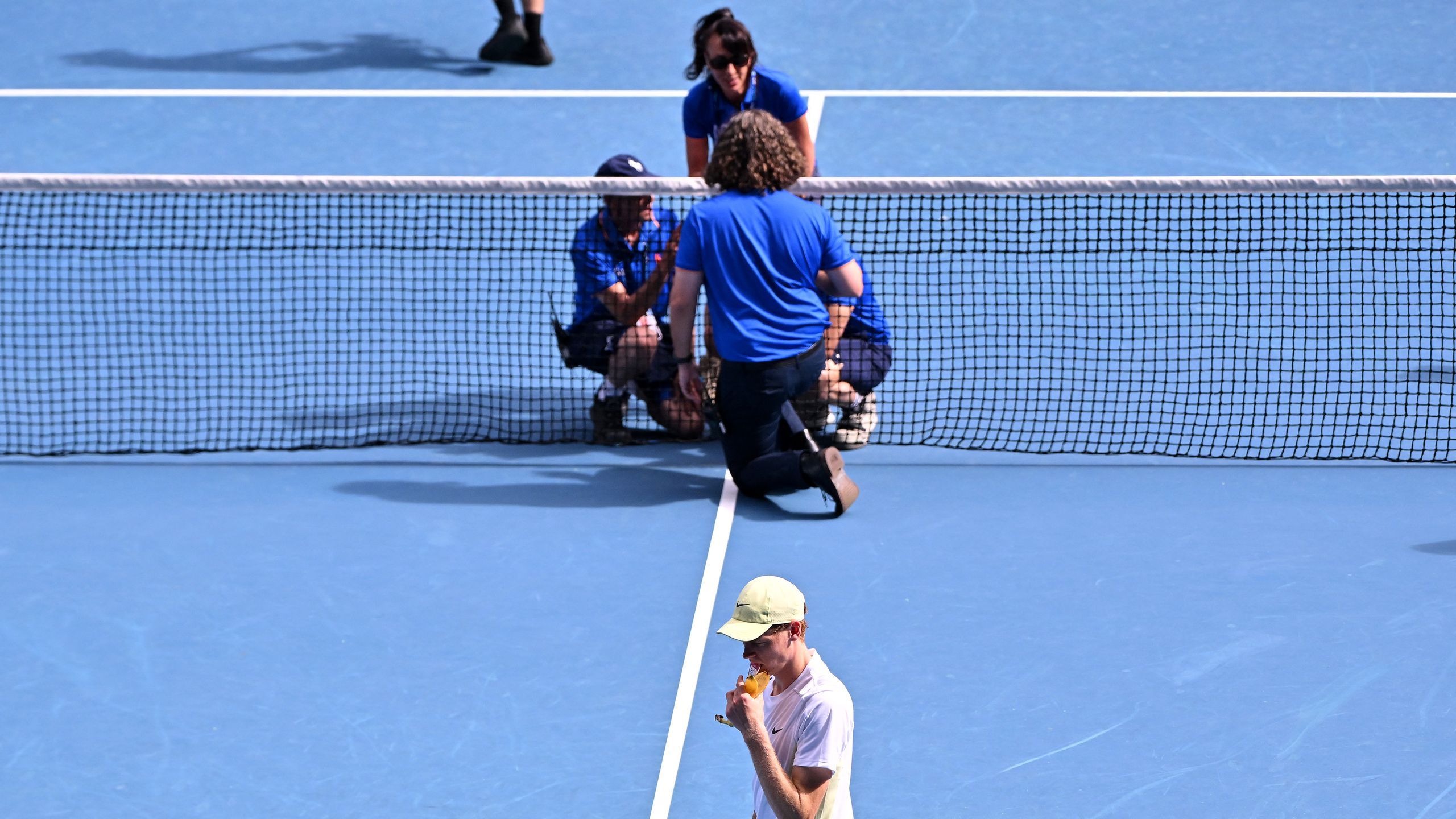 Surreal scenes as 'broken court' stops Australian Open match, Jannik ...