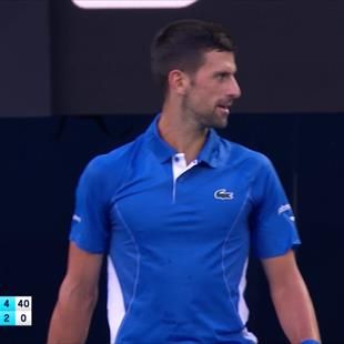 Novak Djokovic reacts to phone ringing in stands during opening match ...